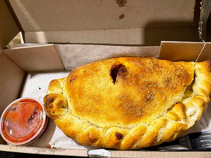 The calzone: pizza's mysterious, folded cousin that keeps its treasures hidden until that first, steam-releasing bite.