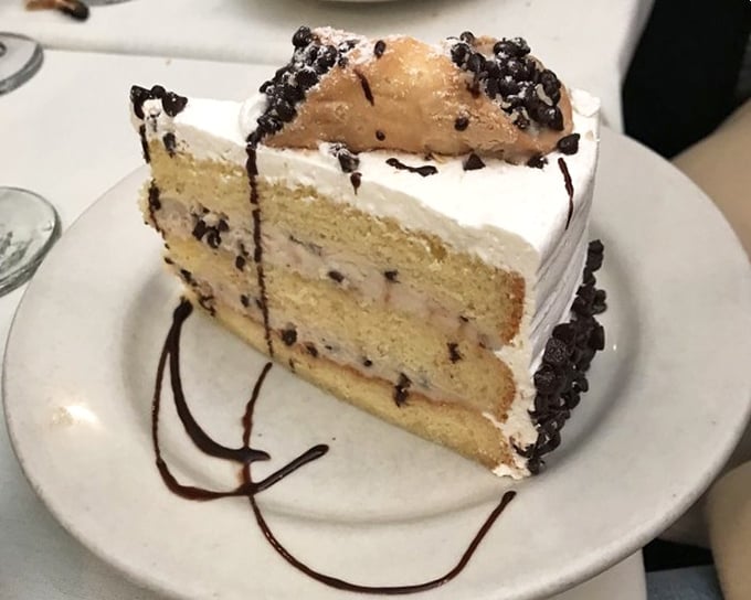 Layer upon layer of vanilla cake and cream—like clouds stacked on sunshine, with chocolate for good measure.