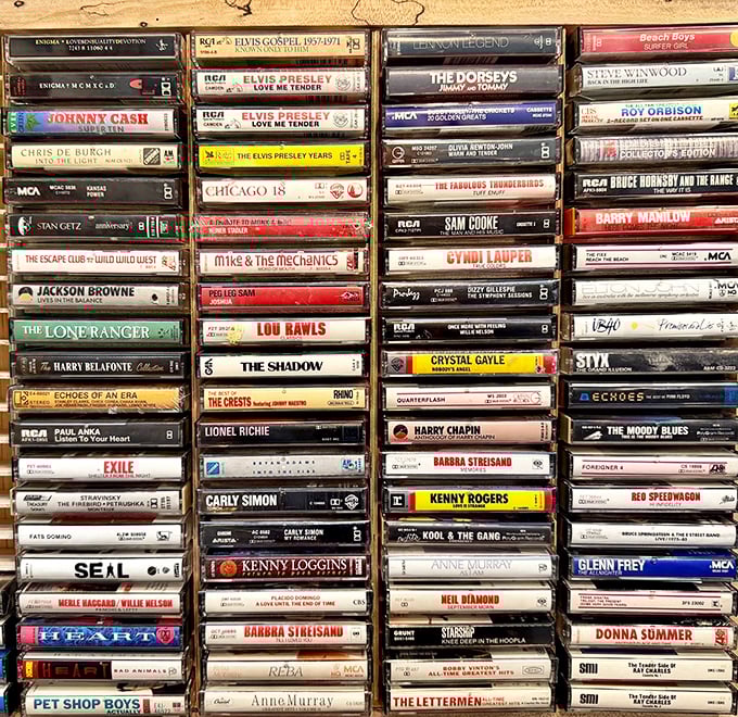The cassette collection reads like a time capsule of American music—Elvis, Johnny Cash, and Barbra Streisand frozen in plastic perfection.