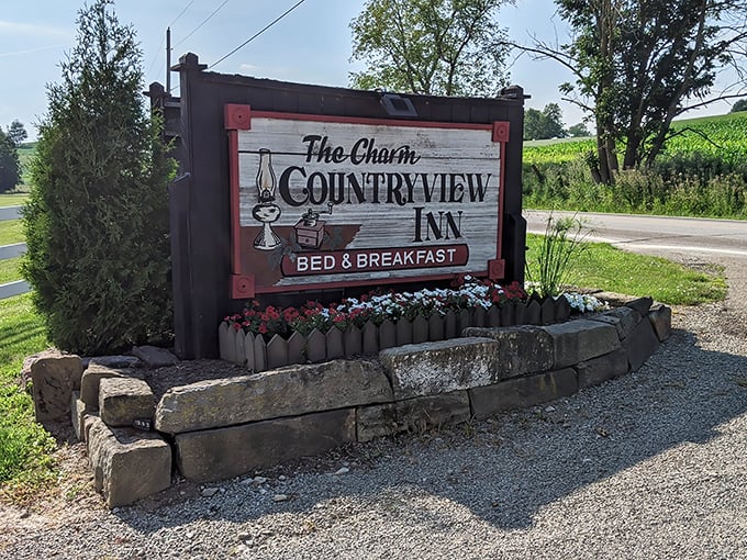 The Charm Countryview Inn sign promises exactly what travelers to Amish Country seek – a peaceful night's sleep with a side of pastoral beauty.