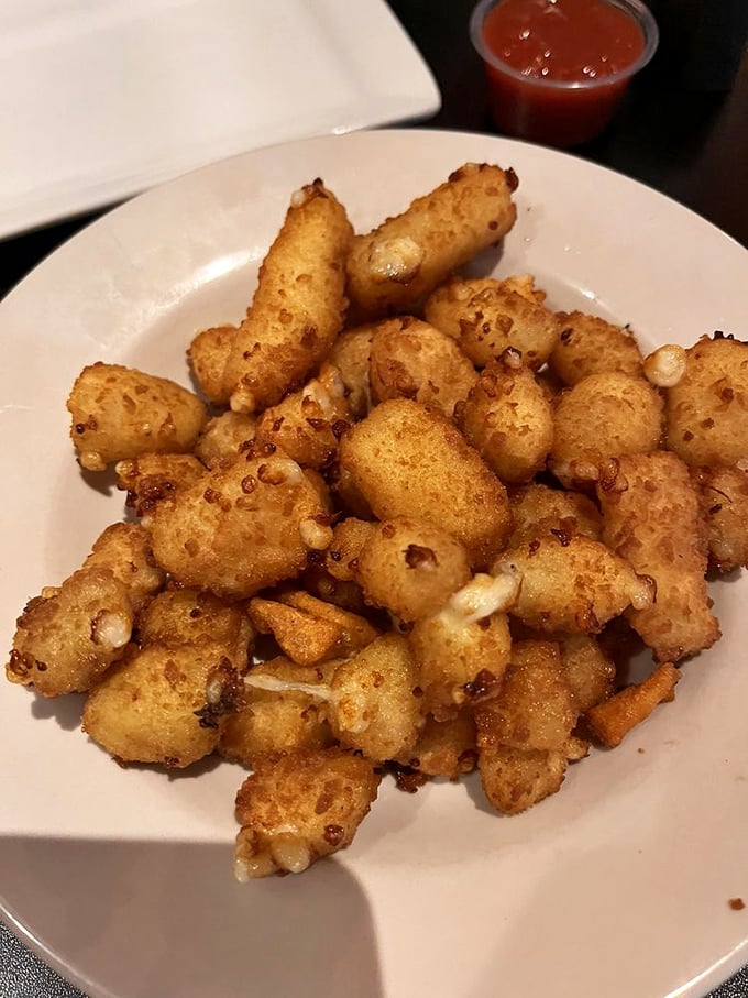These cheese curds aren't just fried—they've been transformed into crunchy, molten-centered flavor bombs that disappear faster than you'd admit.