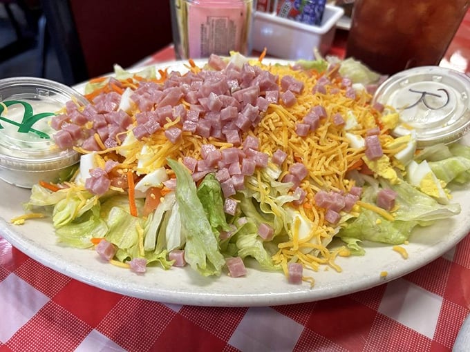 A chef salad that defies the "sad lunch" stereotype with a mountain of toppings that makes eating vegetables feel like cheating.