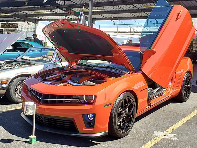 Car show meets marketplace – where automotive dreams park themselves between the pottery booth and handmade jewelry vendor.
