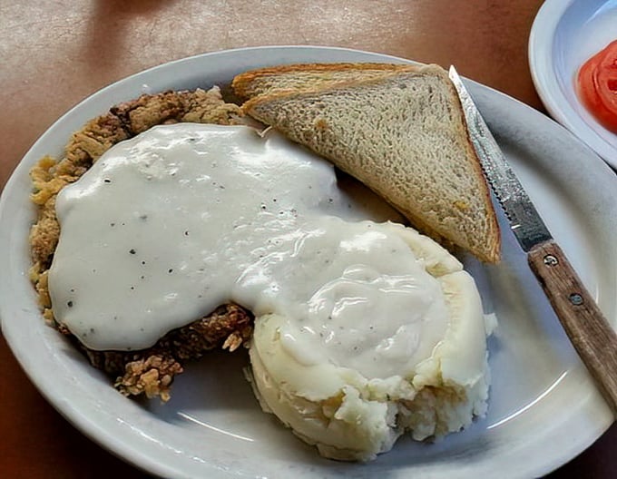Chicken fried steak with gravy isn't just a meal – it's a cultural institution, a testament to the beautiful marriage of crispy coating and tender meat.
