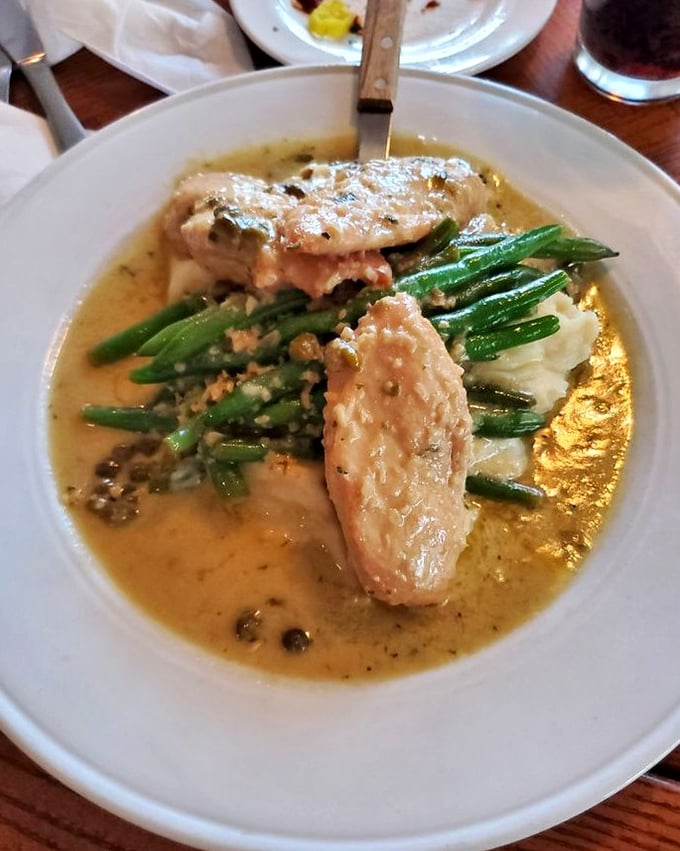 Chicken piccata swimming in a buttery lemon sauce that makes you want to request a spoon for the leftover liquid gold.