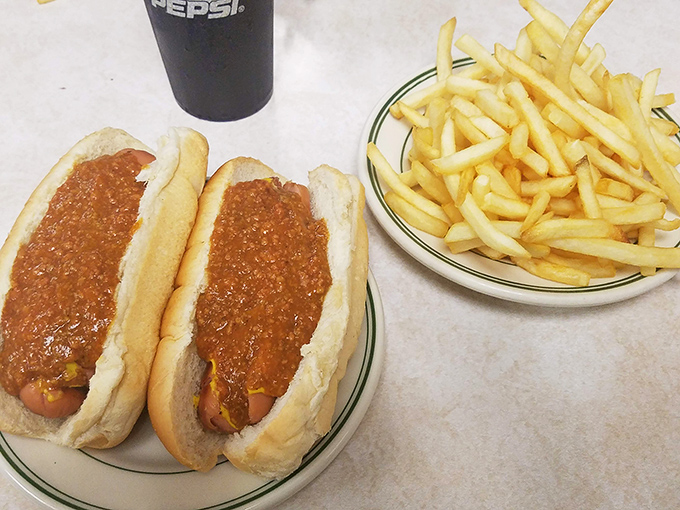 The dynamic duo that's worth the drive. Two perfectly sauced dogs flanked by crispy fries—a plate that defines Pennsylvania comfort food.