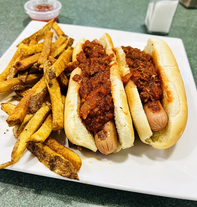 Chili dogs that don't mess around—straight-shooting comfort food that pairs perfectly with those golden fries and zero pretension. 