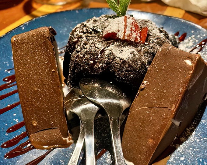 A chocolate dessert that doesn't just satisfy your sweet tooth—it throws a party for it. Those chocolate slabs are pure indulgence on a plate