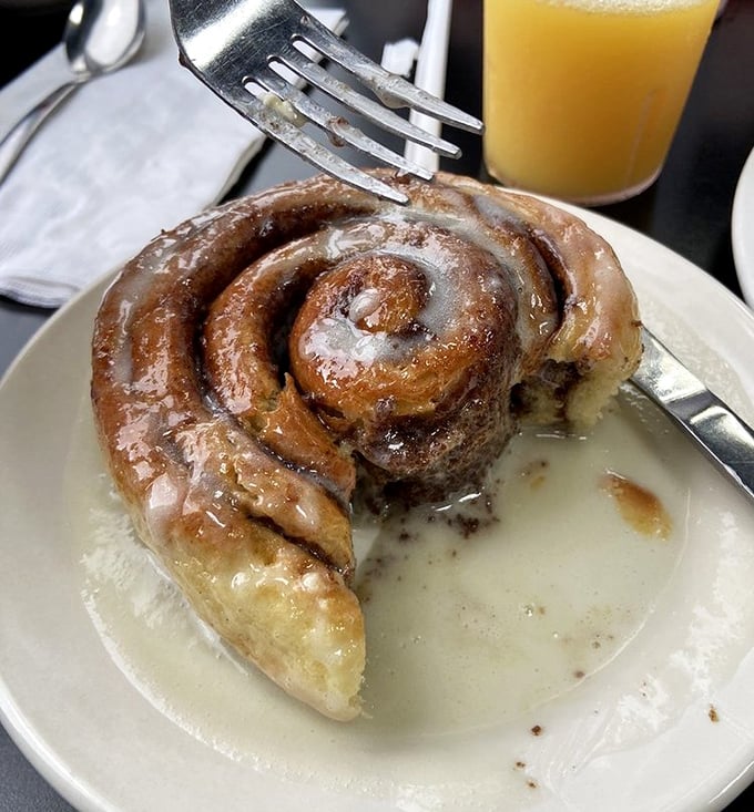 This cinnamon roll isn't just breakfast—it's dessert with an alibi. Swimming in glaze and absolutely no regrets.