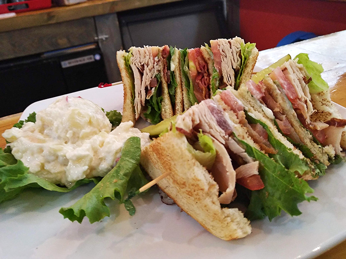 The club sandwich—three stories of deliciousness that makes skyscrapers jealous of its perfect construction.