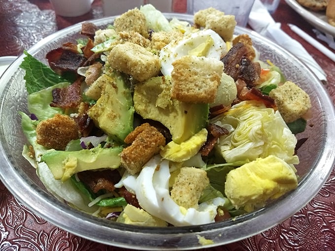 A salad that doesn't apologize for being delicious—loaded with avocado, egg, and bacon that make "eating healthy" feel suspiciously like indulgence.