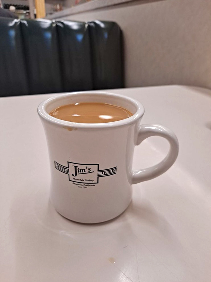 The coffee mug says it all – straightforward, unpretentious, and filled with the liquid motivation needed to face whatever Tuesday has in store.