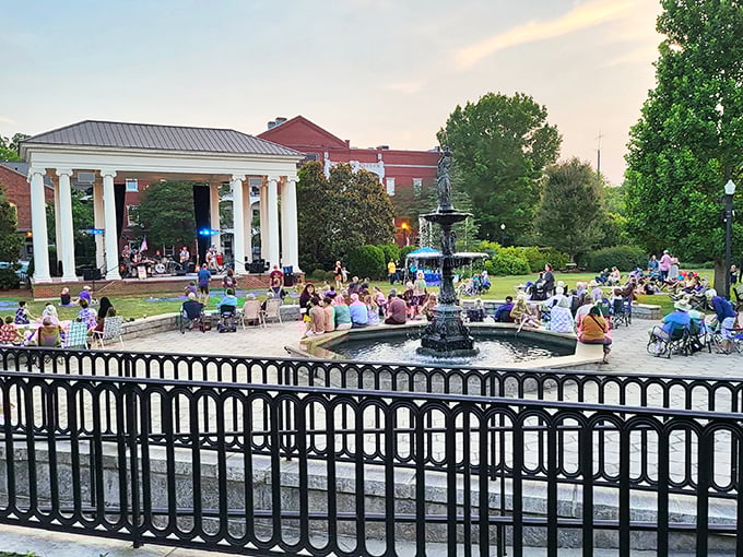 Summer concerts by the fountain where locals gather with lawn chairs and picnic baskets—Norman Rockwell would need more canvas.