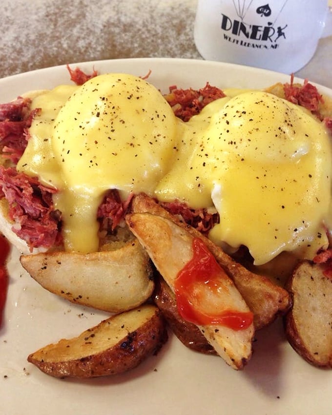 Eggs Benedict with corned beef hash—where hollandaise sauce cascades down like a yellow waterfall of happiness onto a mountain of savory perfection.