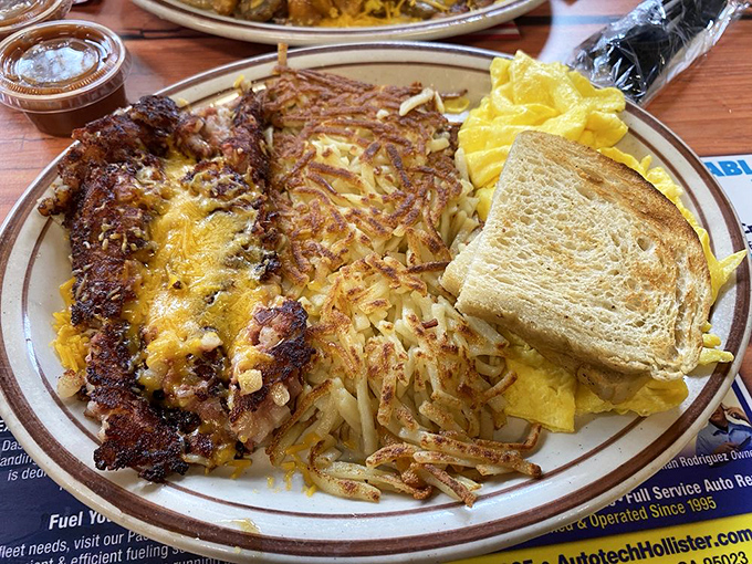 Corned beef hash with eggs and hash browns – the breakfast equivalent of a warm hug from someone who really knows how to cook.
