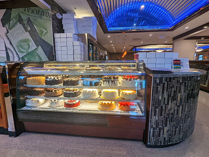 The dessert case—where willpower goes to die and "I'll just have coffee" turns into "I'll have the chocolate cake AND the cheesecake."