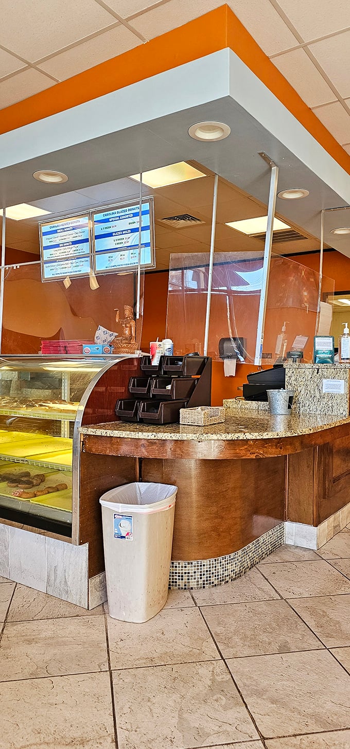 Where donut dreams come true. This counter has witnessed countless moments of pure joy as customers point to their heart's desire.