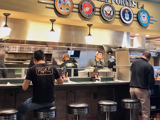 Where the magic happens—the counter seats offer front-row tickets to the culinary show. Dinner and a performance for the price of one.