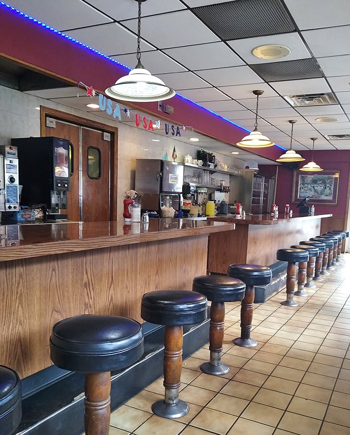 The counter where regulars hold court – these stools have supported generations of Pennsylvania posteriors while coffee flows and gossip swirls.