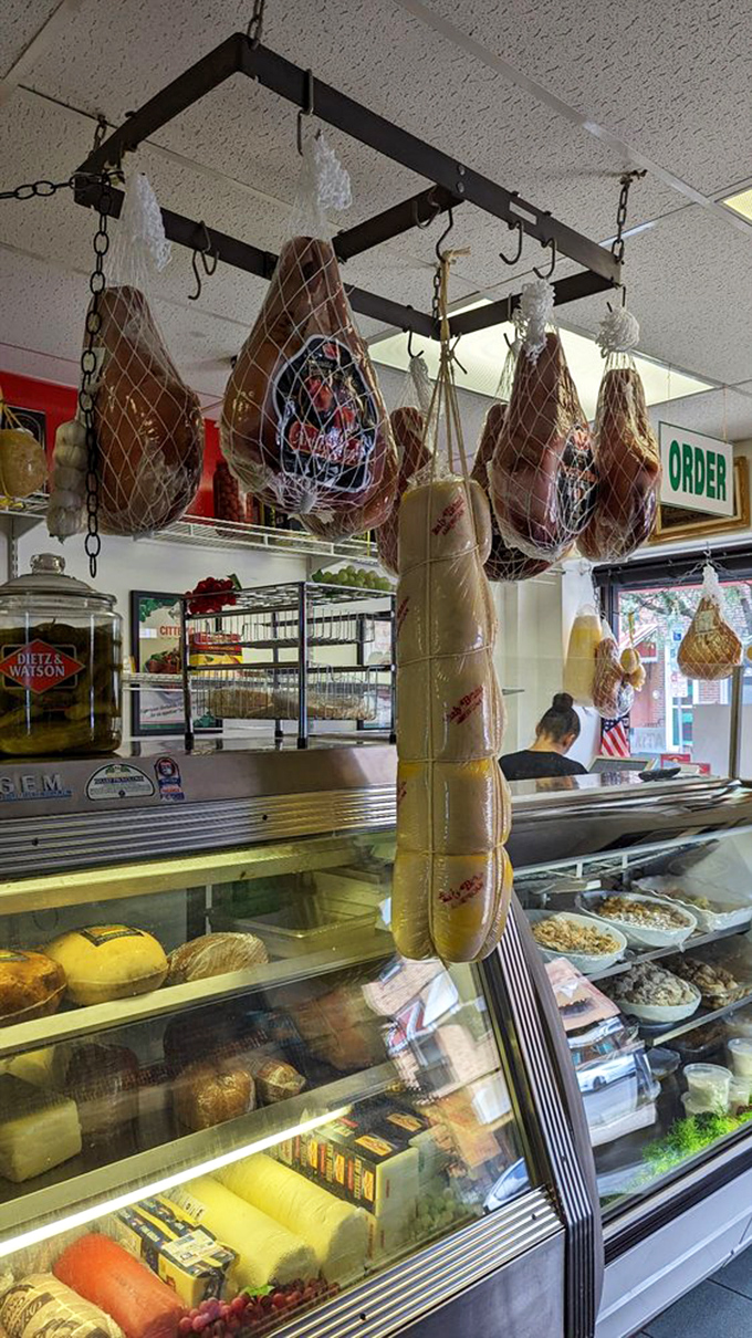Hanging prosciutto legs and cured meats—the ceiling decor that makes Italian food lovers weak in the knees and ready to place an order.