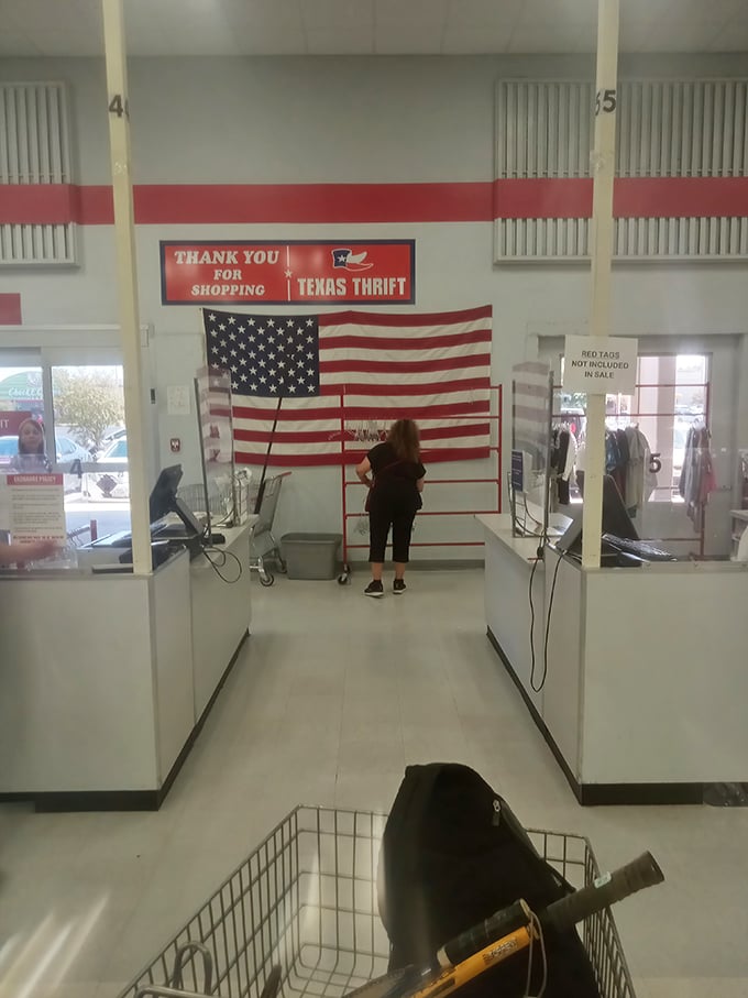 The checkout experience, complete with American flag backdrop—because finding that perfect vintage tee is practically patriotic.