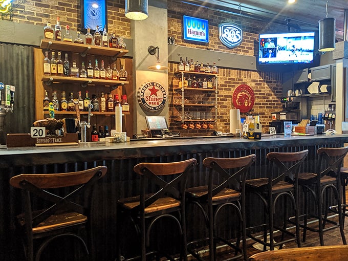 The bar at KINSmoke doesn't just serve drinks – it creates the perfect backdrop for stories that get better with each bourbon.
