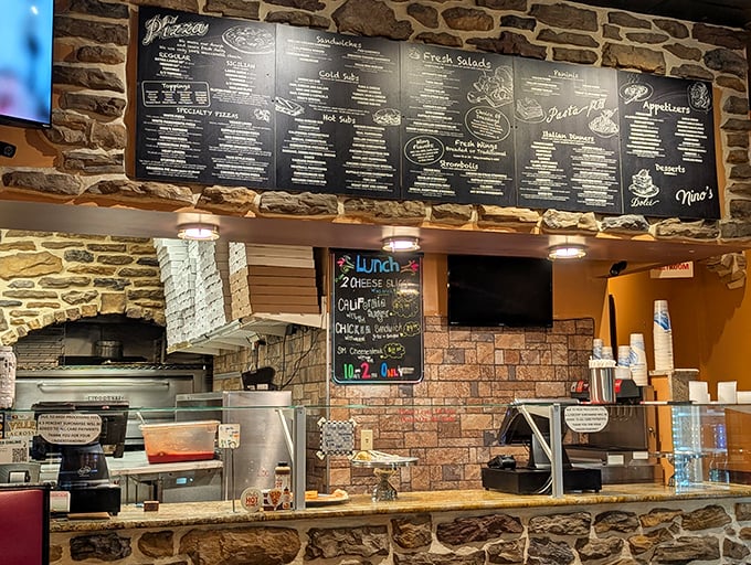 Behind this counter, culinary magic happens daily—the chalkboard specials hinting at what treasures await the hungry.