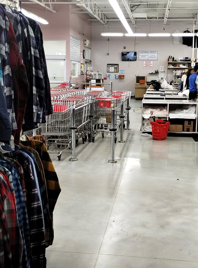 The checkout line—where dreams meet reality and shopping carts form an orderly procession toward thrift victory.
