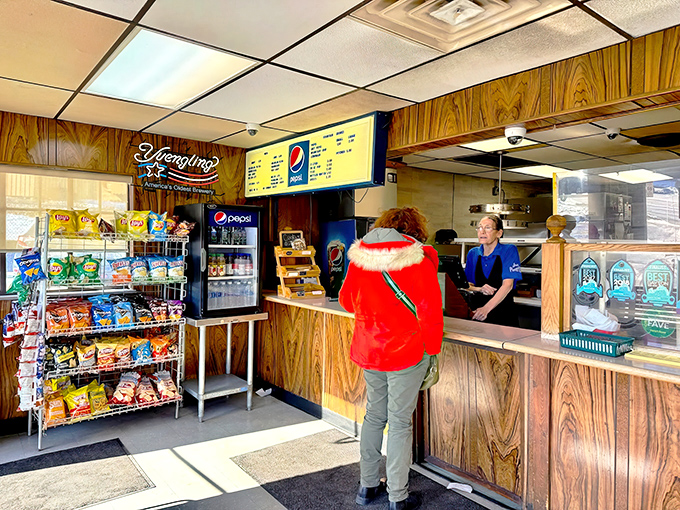 The ordering counter—that magical portal where your pizza dreams begin their journey toward delicious reality.