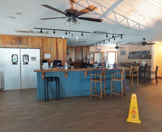 The bar area combines coastal blue with natural wood elements—like the ocean meeting the shore in an interior design love story.