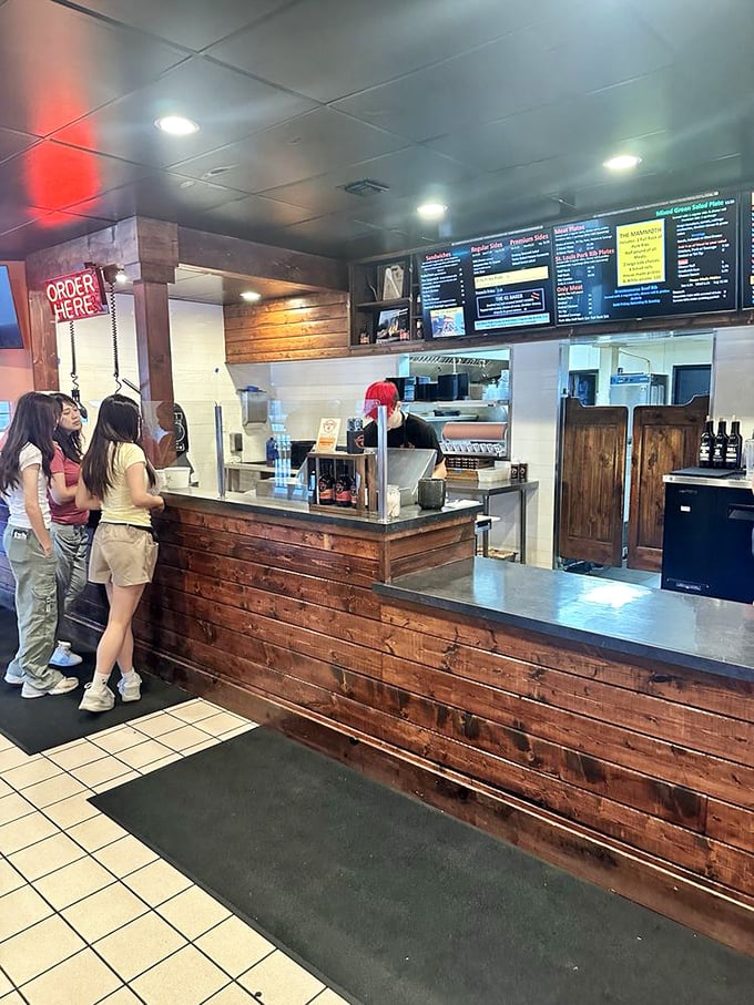 The ordering counter keeps it simple: pick your meat, pick your sides, prepare for bliss. No complicated decisions required.