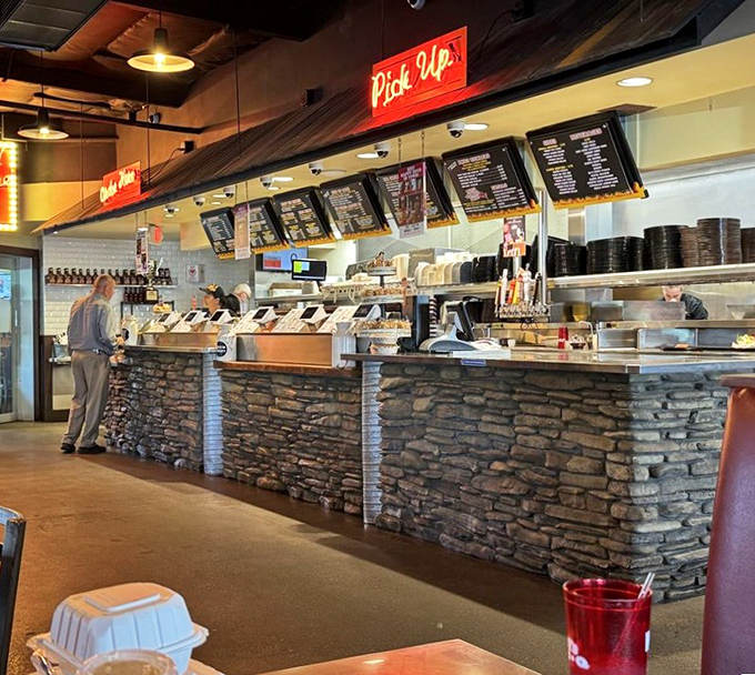 The ordering counter – where dreams are verbalized, anticipation builds, and the staff somehow maintains smiles despite the constant meat-seeking masses.