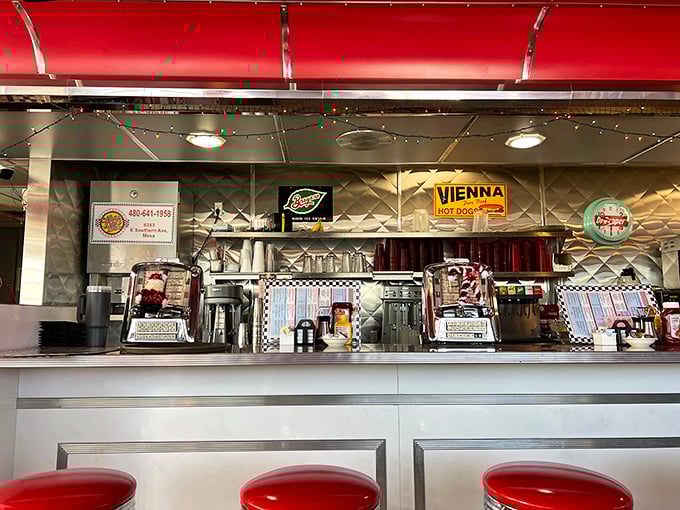 The counter—where solo diners find community, regulars exchange local wisdom, and everyone gets a front-row seat to short-order magic.