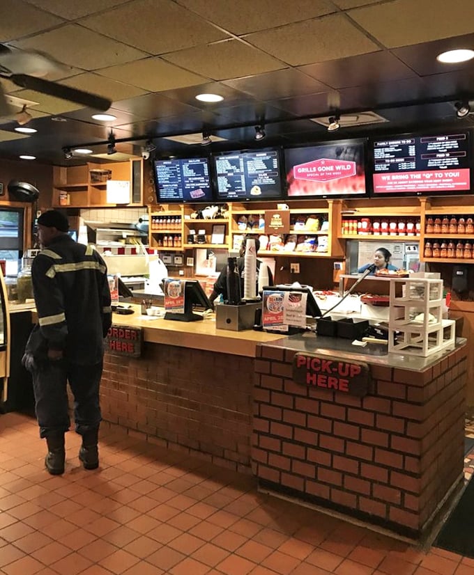 The order counter—where dreams are placed and fulfilled. "Pick Up Here" might be the three most beautiful words in English.