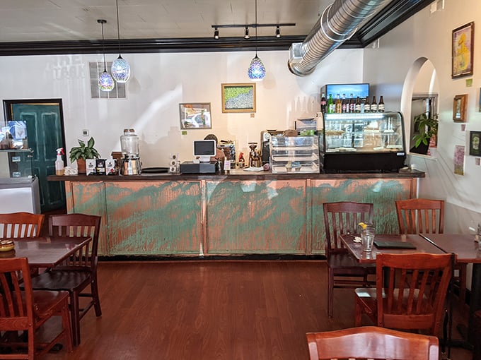 Behind this counter, breakfast dreams become reality – the command center where coffee flows and pastries find their purpose.