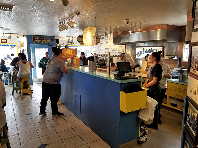 The counter – where dreams are ordered, anticipation builds, and staff orchestrate a symphony of seafood satisfaction.