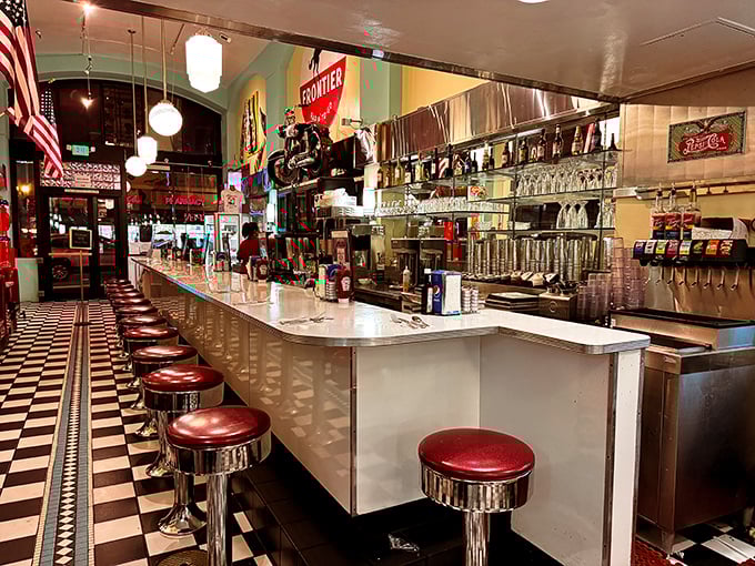 Chrome stools lined up at a gleaming counter—the best seats in the house for watching short-order magic happen before your eyes.