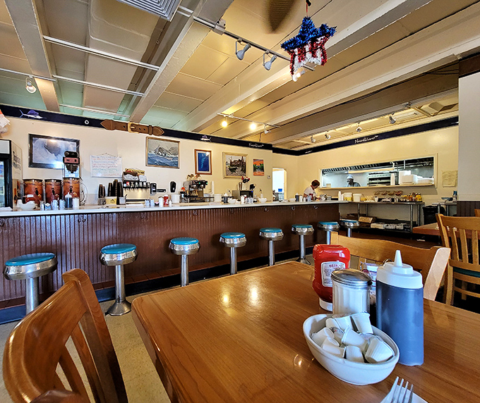 Counter seats offer front-row views of the breakfast ballet happening behind the service window.