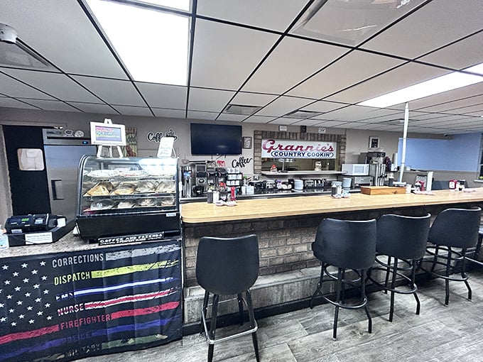 The counter tells stories of first dates, family traditions, and regulars who've claimed their spots like homesteaders. Note the first responder tribute.
