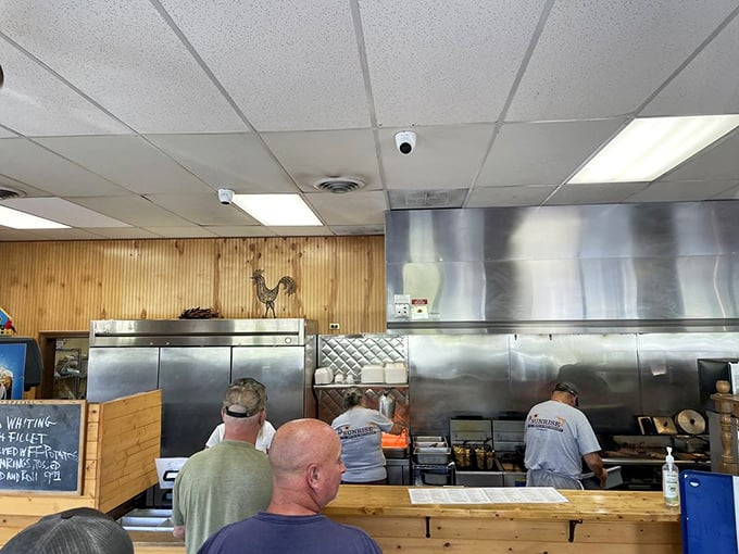 Where the magic happens—stainless steel and efficiency, with cooks who move with the practiced choreography that comes from years of feeding hungry South Carolinians.