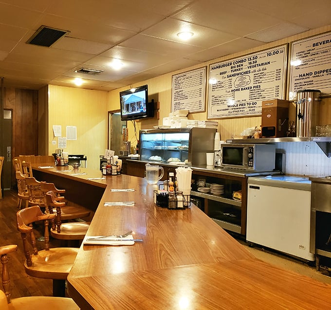The counter isn't just where you eat—it's where you witness the theater of short-order cooking, performed by veterans who've mastered every move.