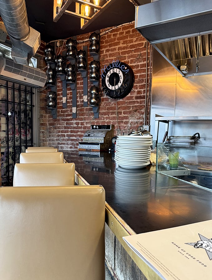 Counter seating where solo diners become philosophers and coffee cups never run empty—the diner social contract.
