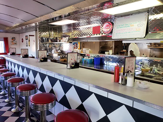 The counter—where solo diners find community and everyone gets a front-row seat to the short-order symphony. Those stools have heard it all. 