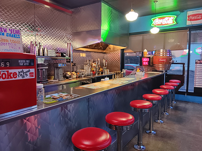 Classic counter seating where you can watch culinary magic happen while perched on red stools that have witnessed countless coffee refills.