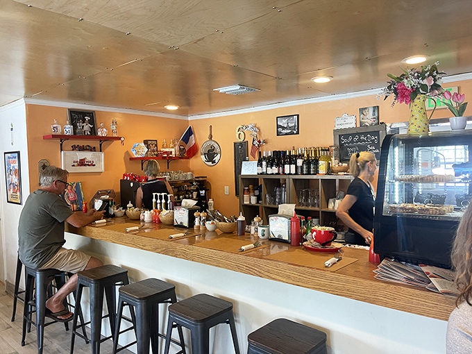 The counter seating—where solo diners become regulars and the staff eventually knows your order before you do.