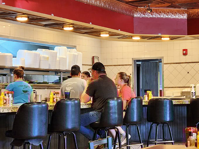 Counter seating: where solo diners become part of the Coffee Mug family and kitchen theater unfolds before your eyes.