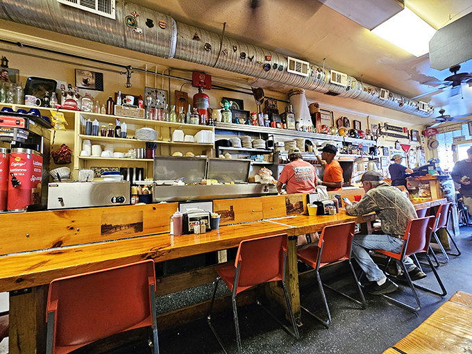 The counter seats—always the best real estate in any diner—offer front-row tickets to the choreographed dance of short-order cooking at its finest.