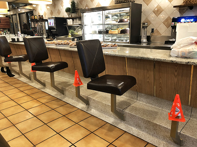 Counter seats: where solo diners become temporary food critics and the staff's banter becomes part of the essential seasoning of your meal.