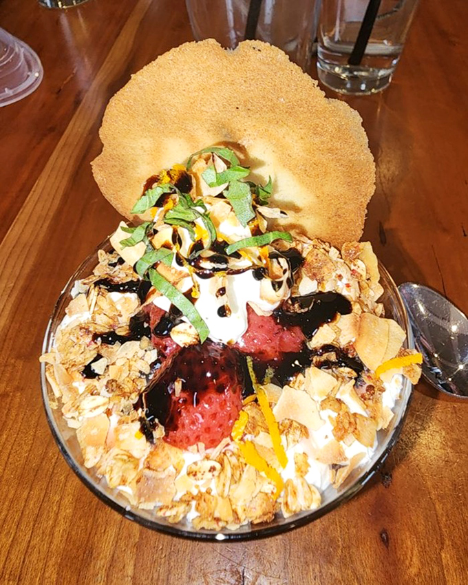 This dessert doesn't just satisfy your sweet tooth—it throws a party for it, complete with a crisp cookie hat that's begging to be shattered.