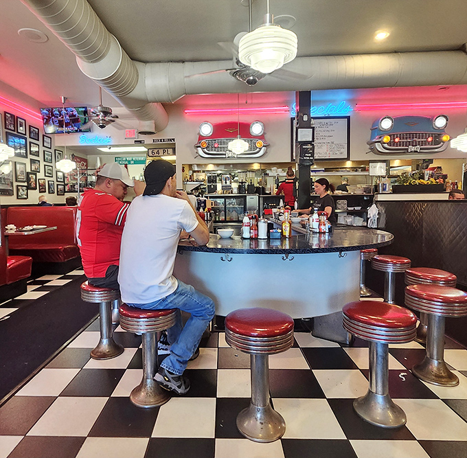 The circular counter isn't just functional—it's social architecture, turning strangers into neighbors over coffee refills and shared condiments.